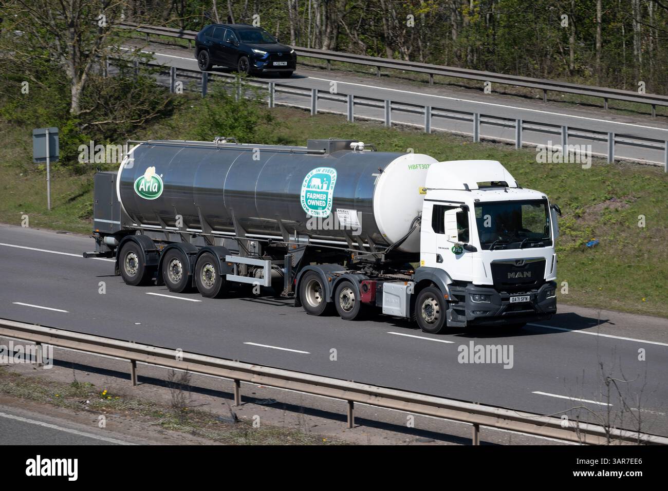 Arla tanker lorry on the M40 motorway, Warwickshire, UK Stock Photo - Alamy