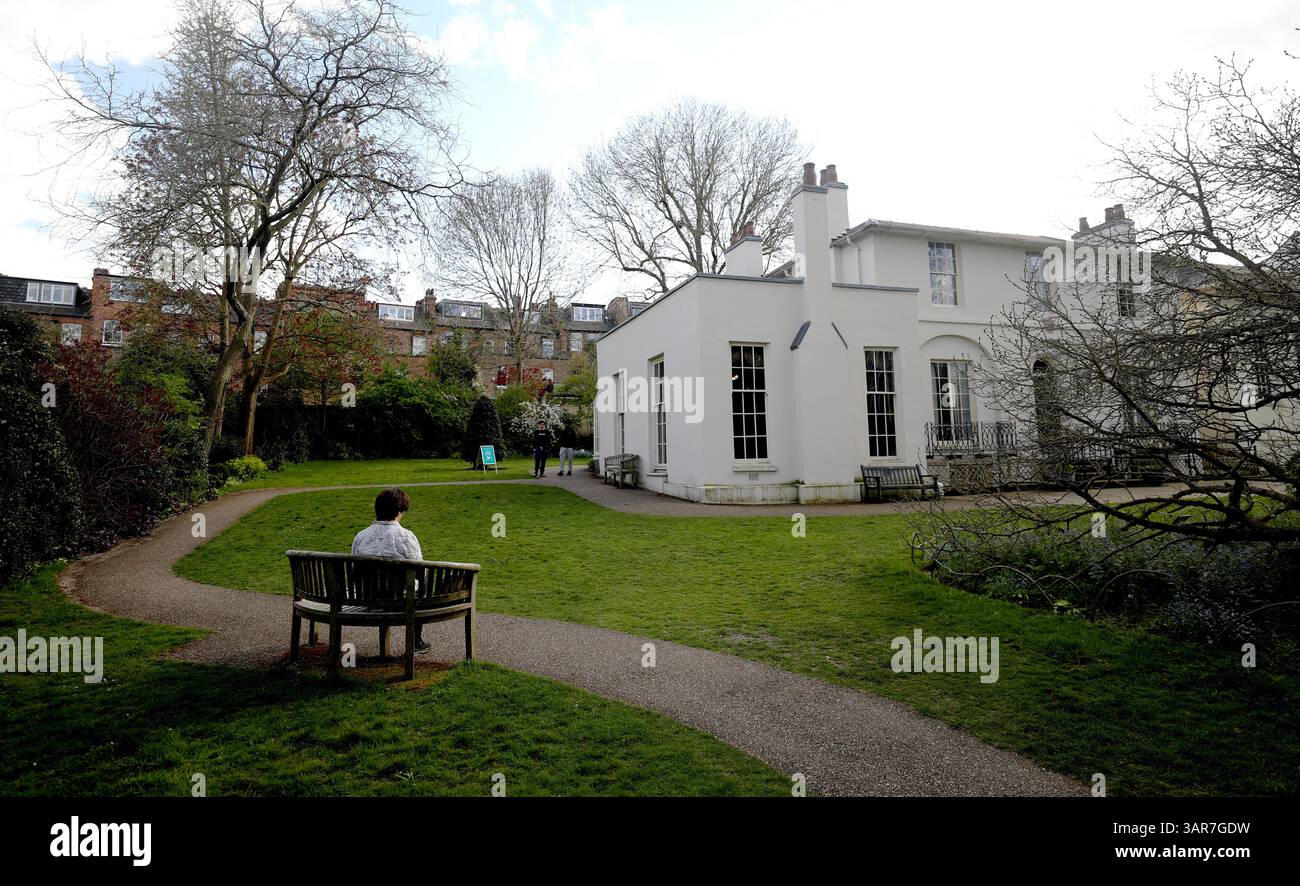 London, Britain. 16th Apr, 2025. A visitor reads at the garden of Keats ...
