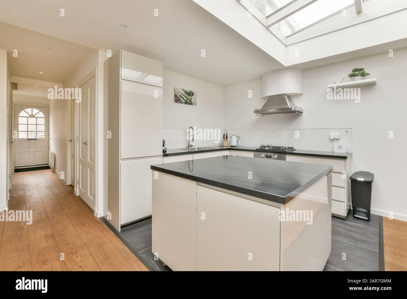 A sleek, modern kitchen showcasing minimalist design, featuring white ...