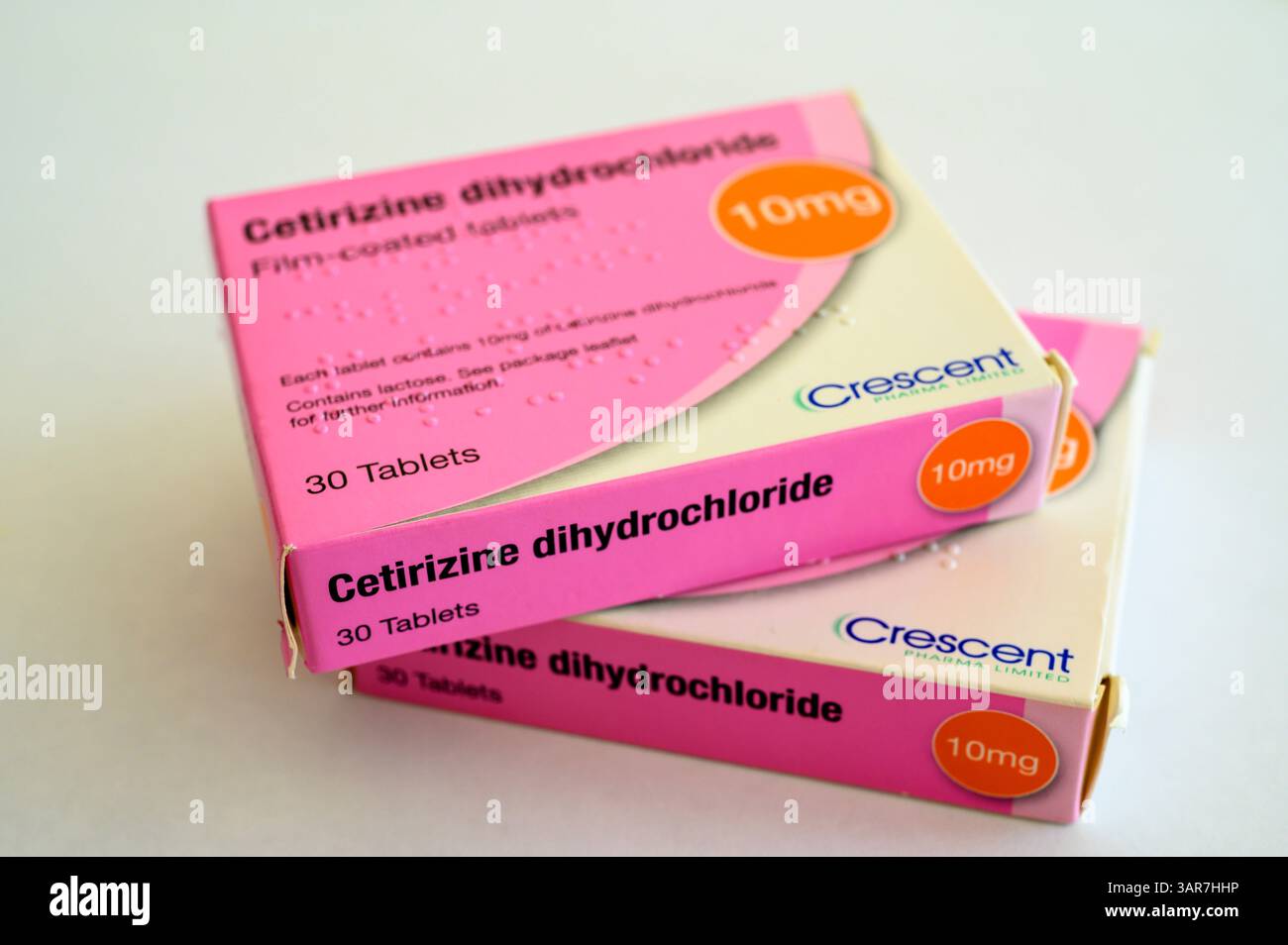 Packets of Cetirizine dihydrochloride antihistamine tablets for allergy ...