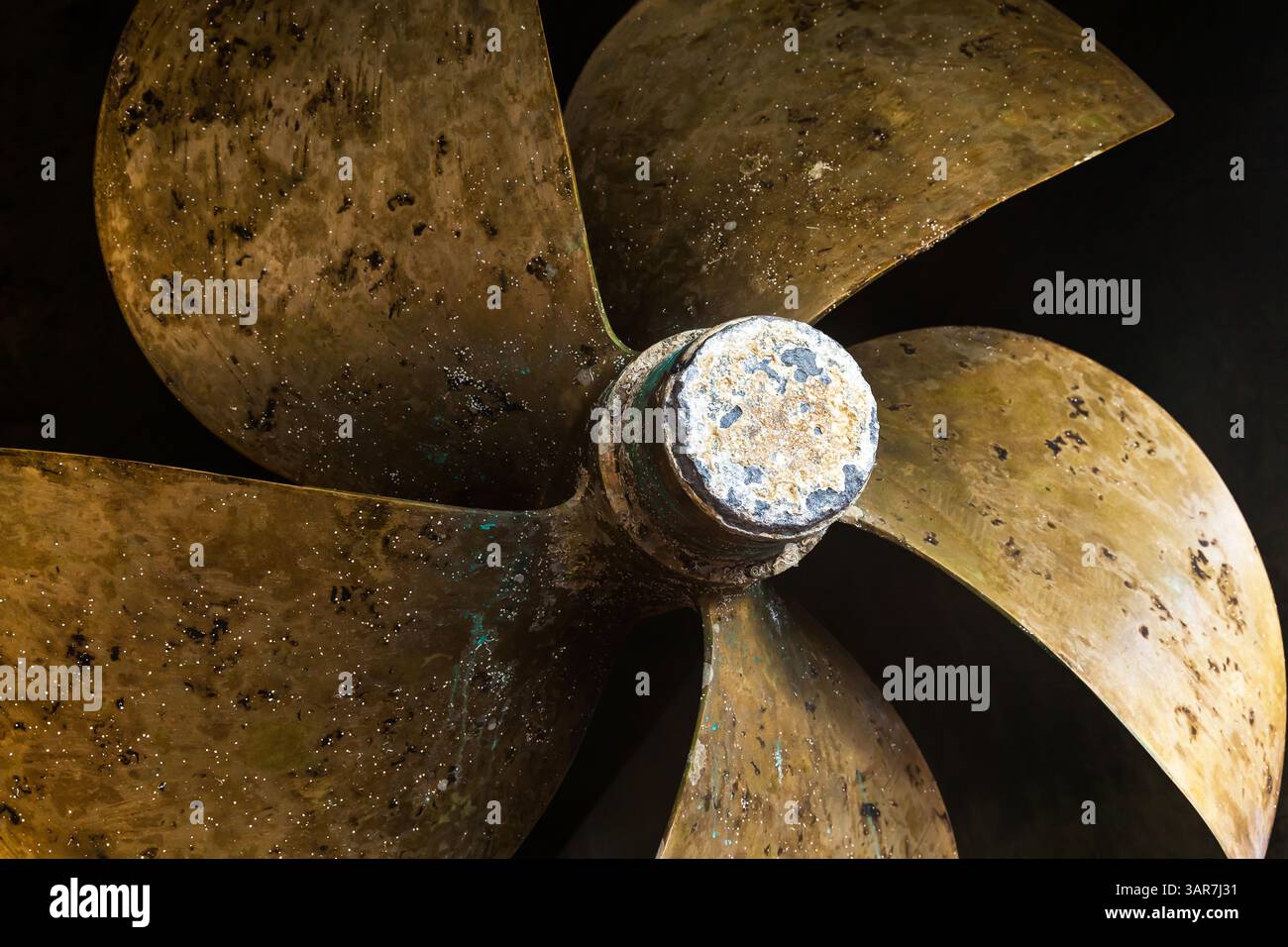 Five bladed ship propeller close-up, with zinc corrosion protection in ...