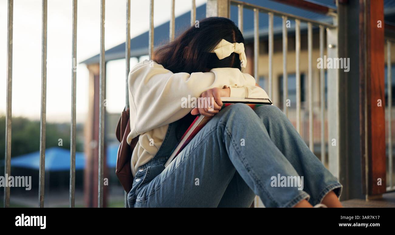 Girl, sad and lonely with crying at school with depression, bullying or ...