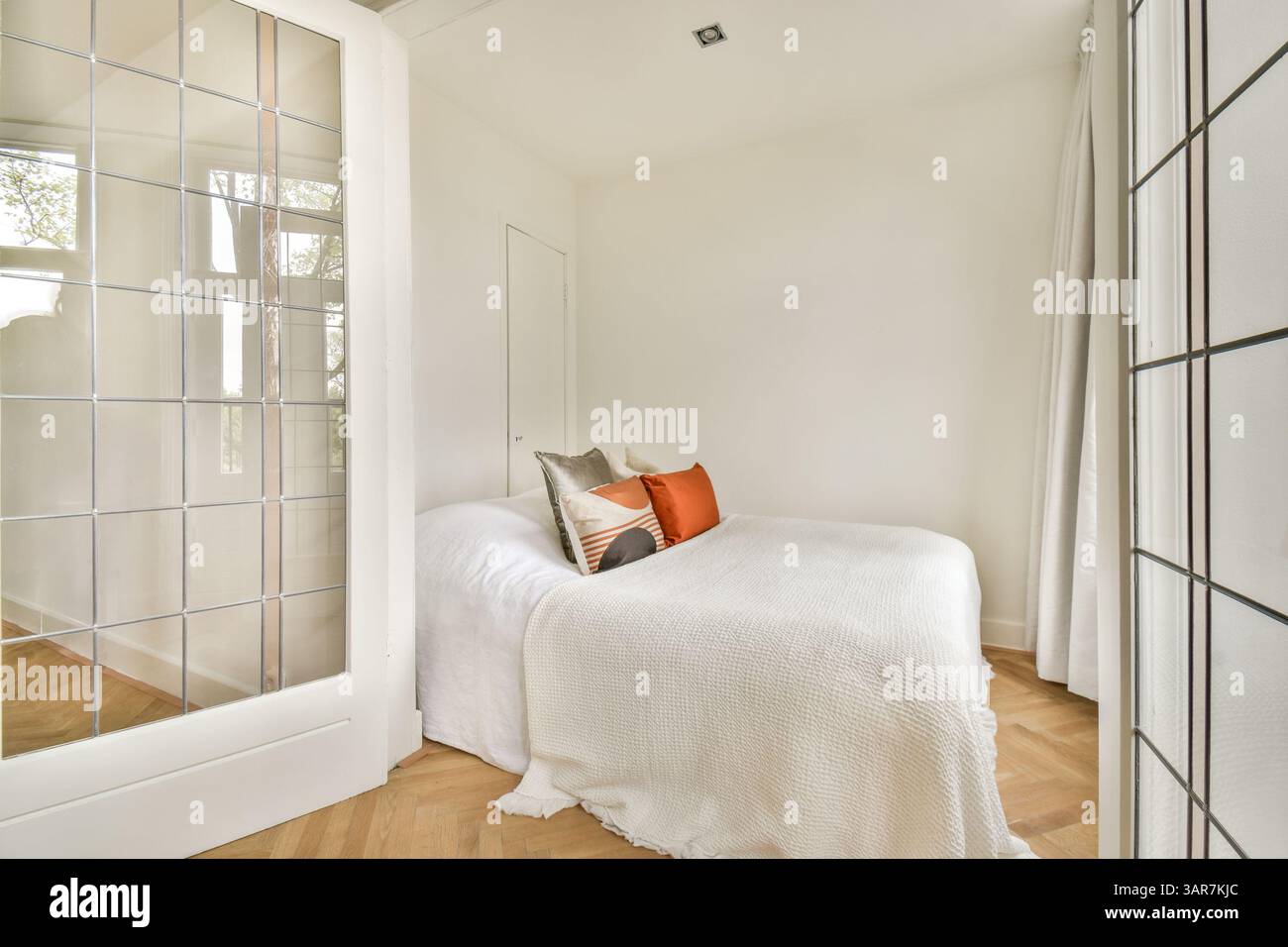 A bright and airy bedroom featuring a modern minimalist aesthetic ...