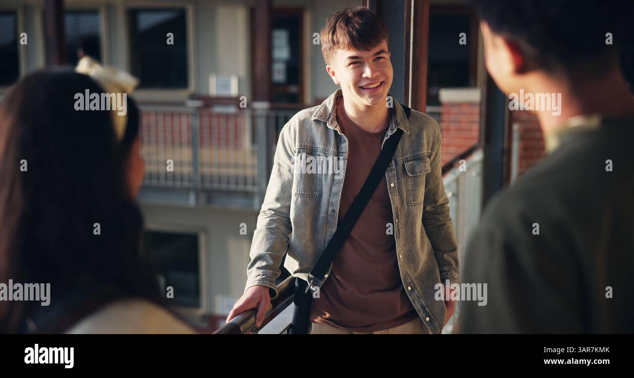 Boy, students and talking in hallway at high school for education break ...