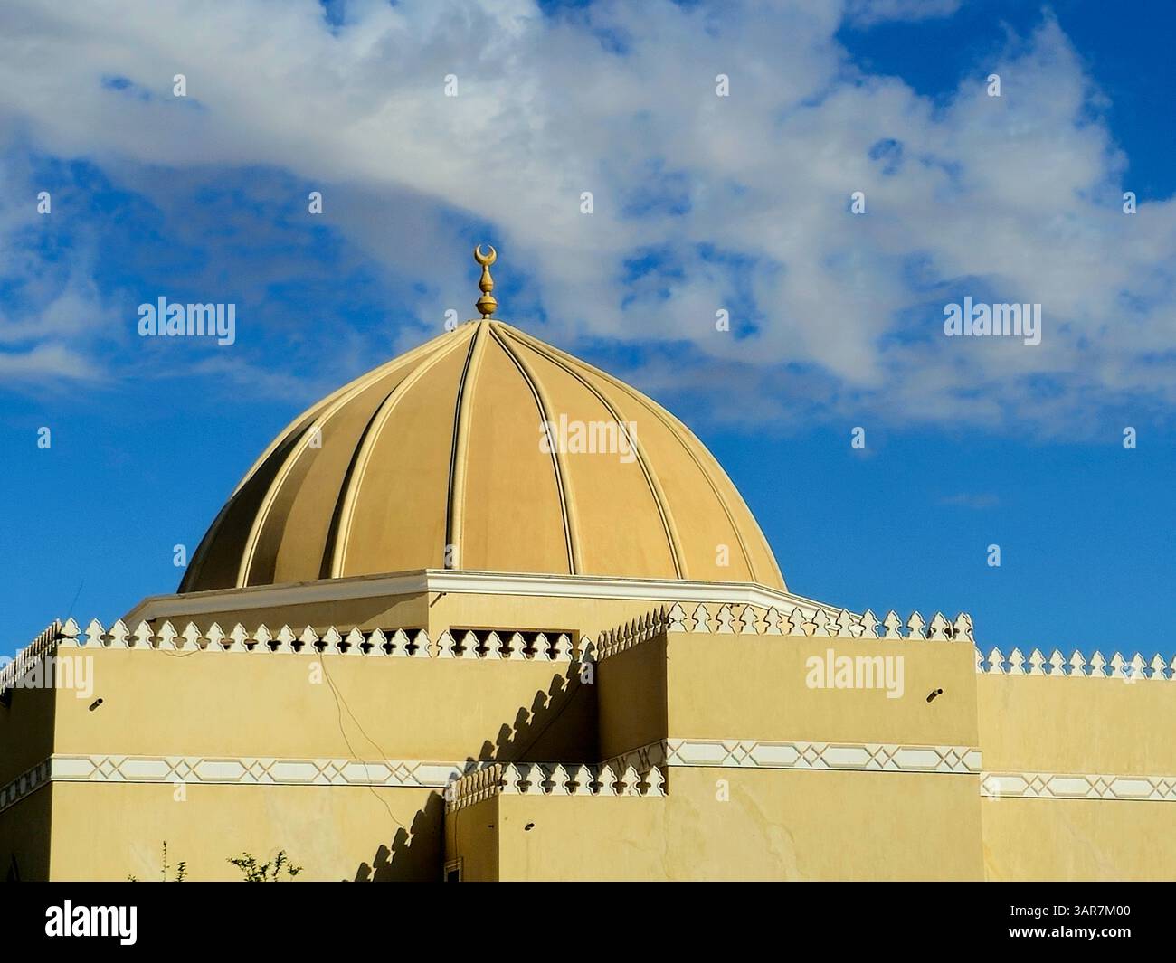 The dome of a new mosque on a blue sky and clouds at the daylight ...