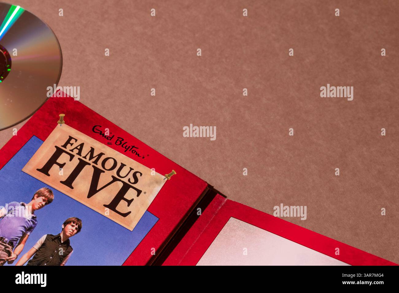 The Famous Five open dvd case with disc isolated on cardboard Stock ...