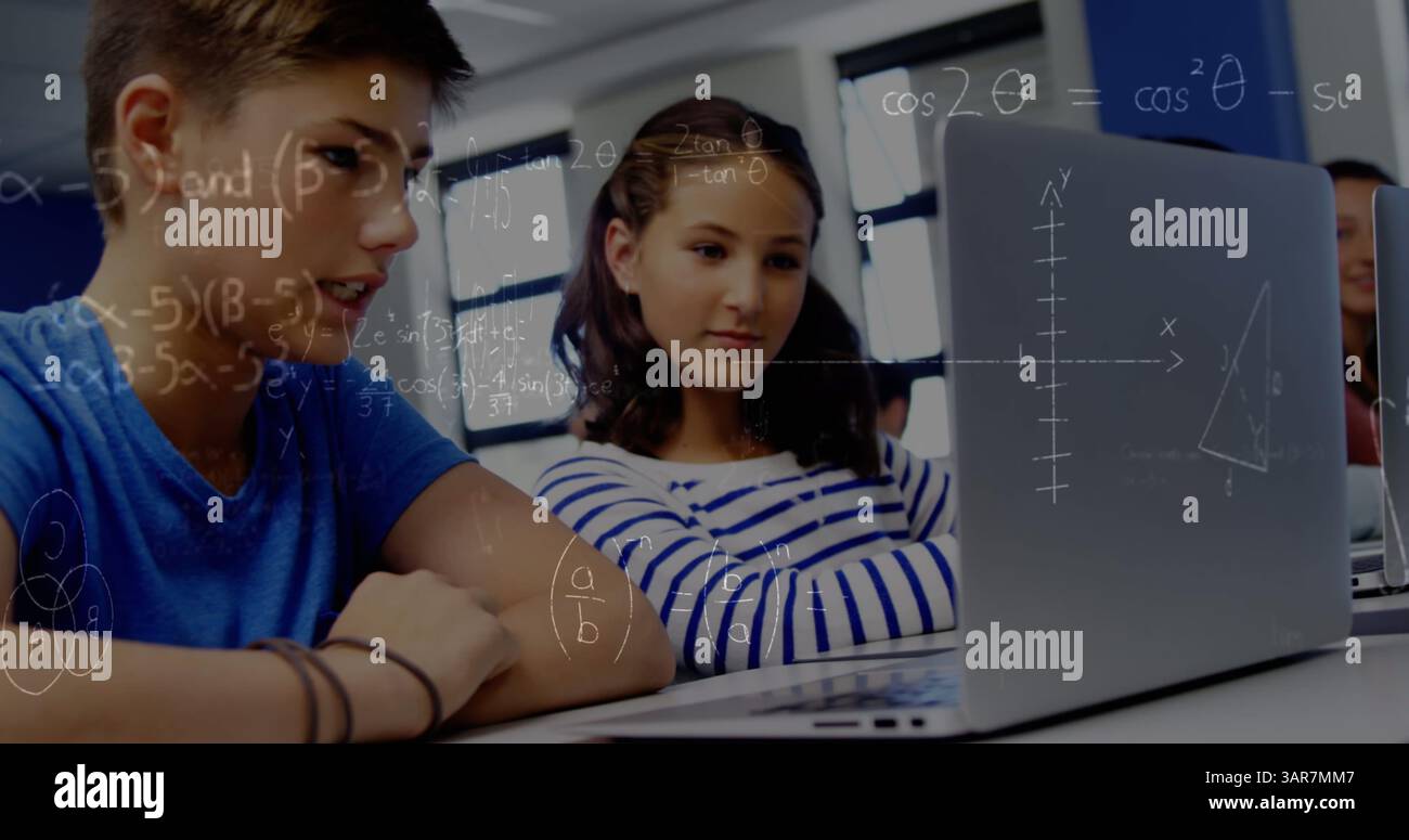 Image of mathematical equations over students using laptop in classroom ...