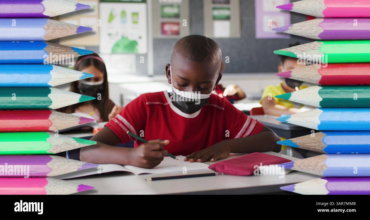 Image of crayons over diverse schoolchildren wearing face masks Stock ...