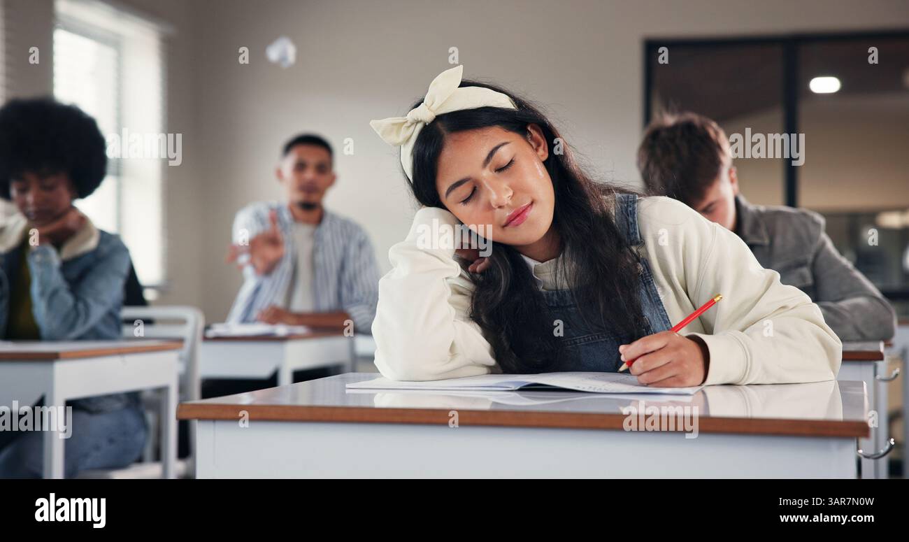 Girl, tired and sleeping with notebook in classroom for education ...