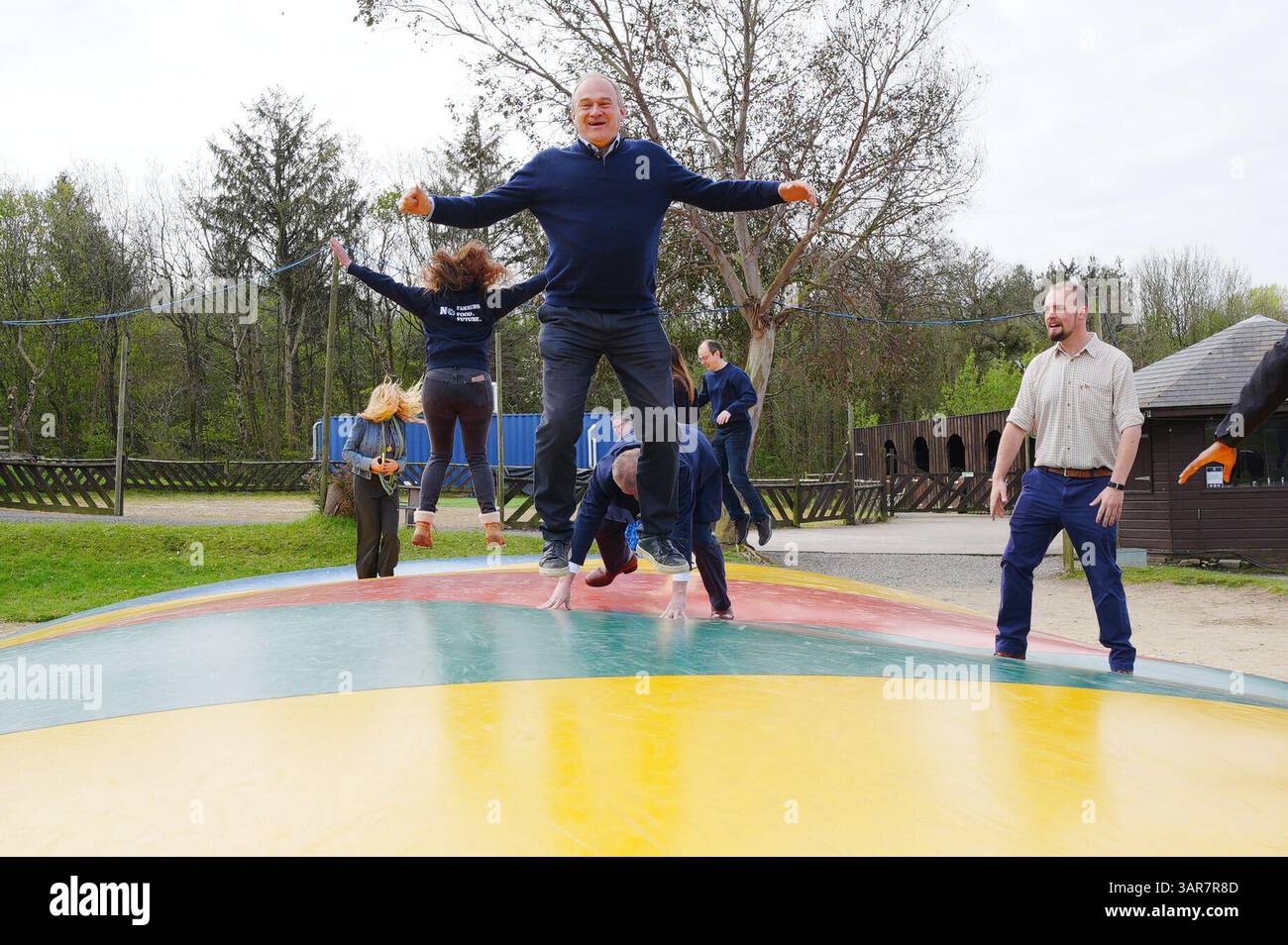 Liberal Democrats leader Sir Ed Davey has a go on the multi coloured ...