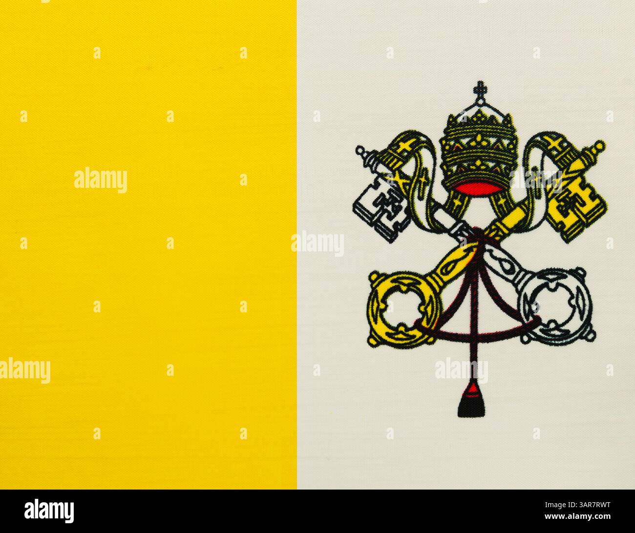 A rectangular flag of Vatican City featuring a solid yellow section and ...