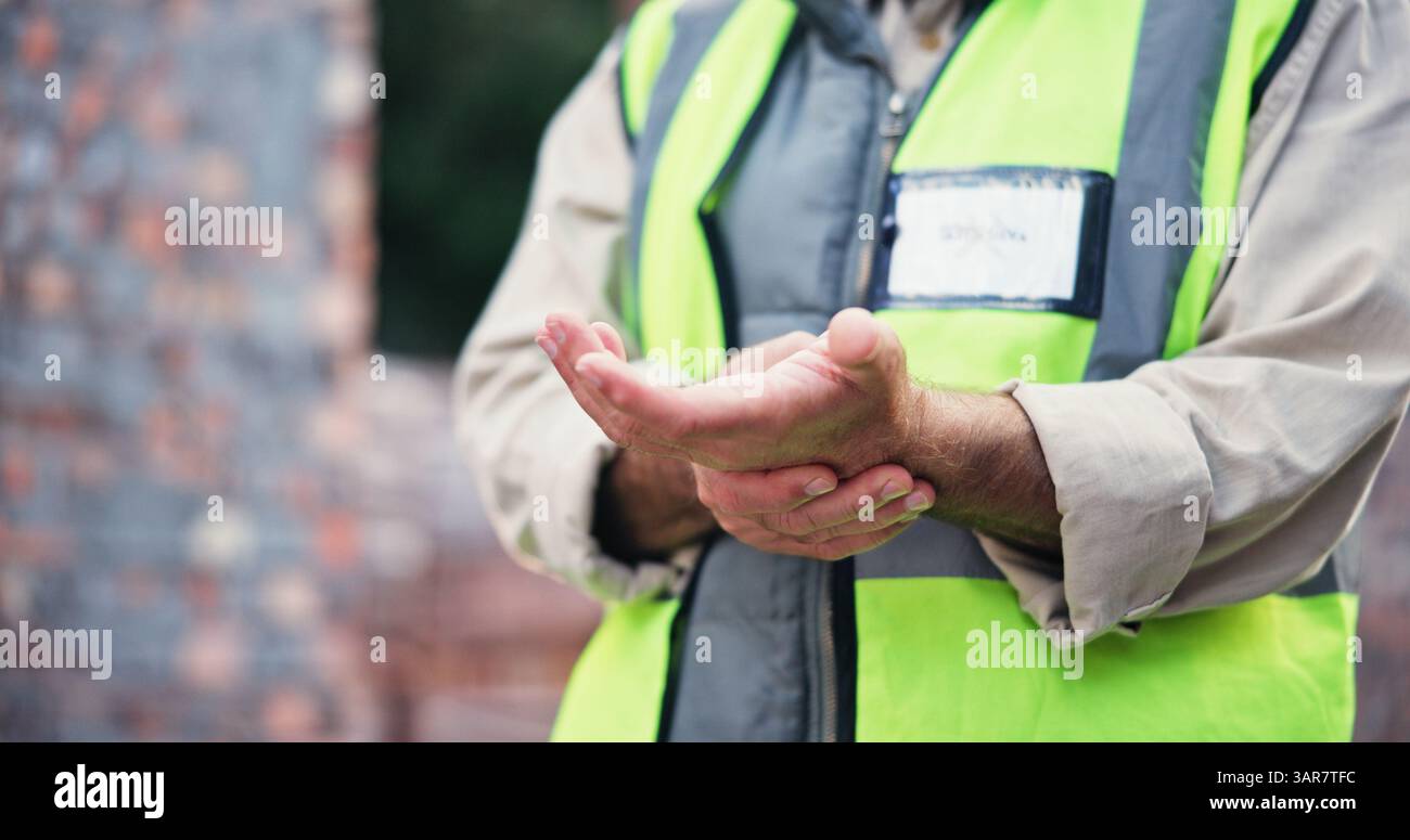 Hands, person and wrist pain with construction injury, work site ...