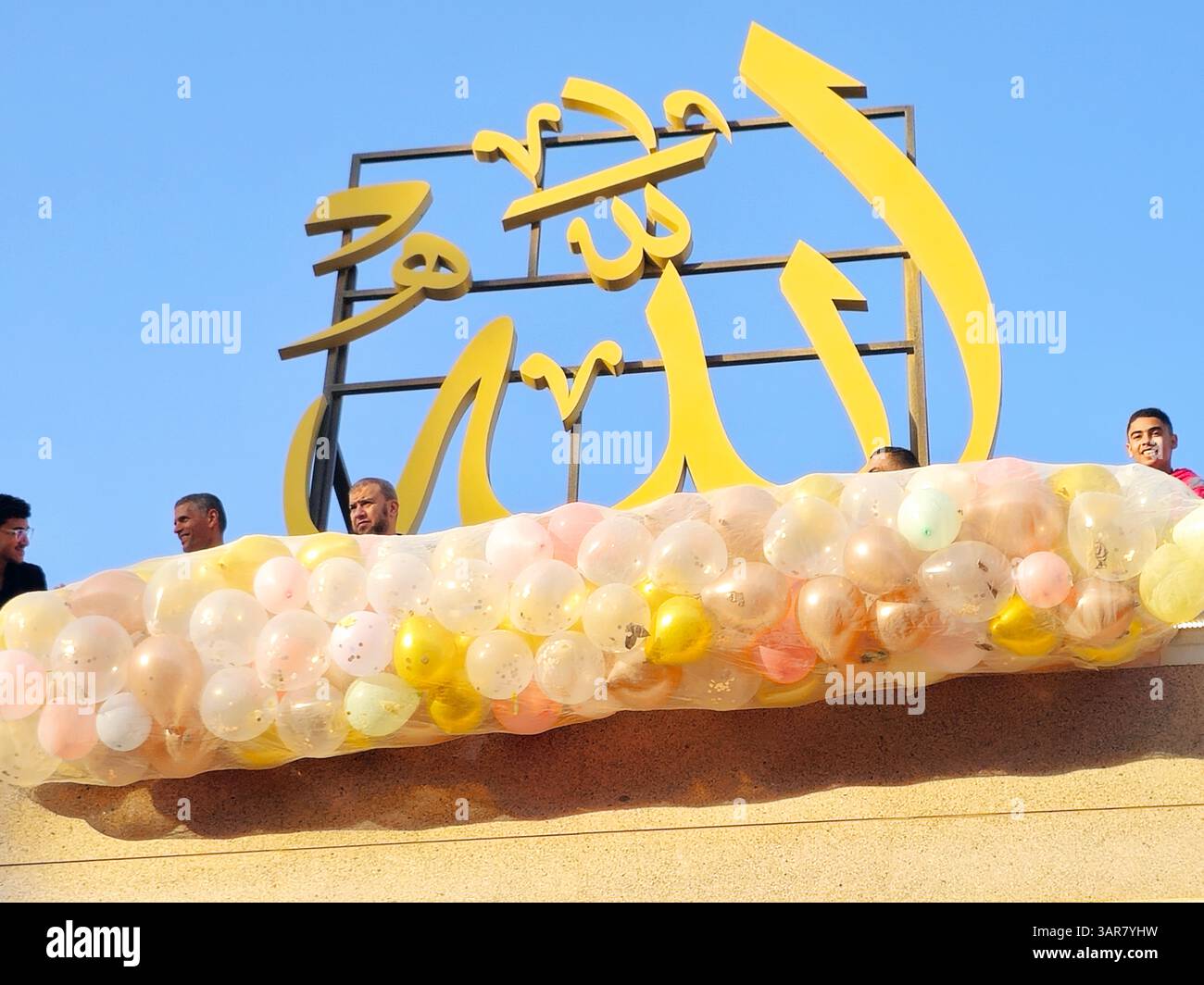 Cairo, Egypt, March 31 2025: Preparation to celebrate with kids in a mosque, throwing balloons ...