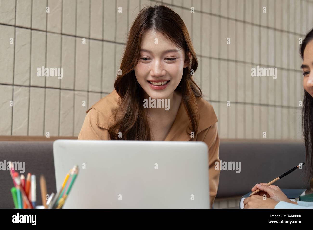 Engaging Learning Moment. A university student smiles while discovering ...