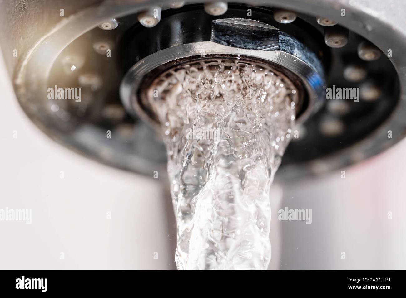 Bavaria, Germany - April 16, 2025: Fresh water flows from a tap - a ...
