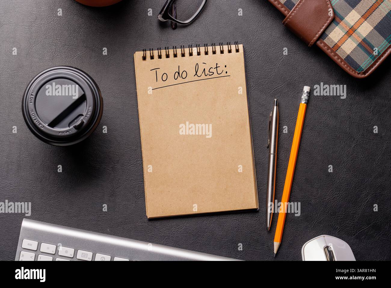 Organized work desk setup with PC, office supplies, coffee and a ...