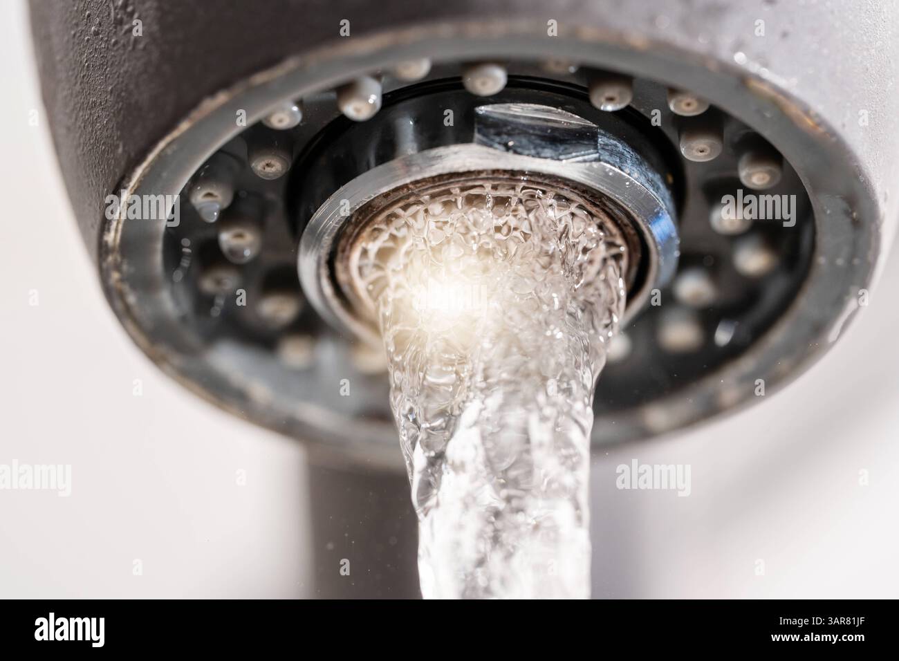 Bavaria, Germany - April 16, 2025: Fresh water flows from a tap - a ...