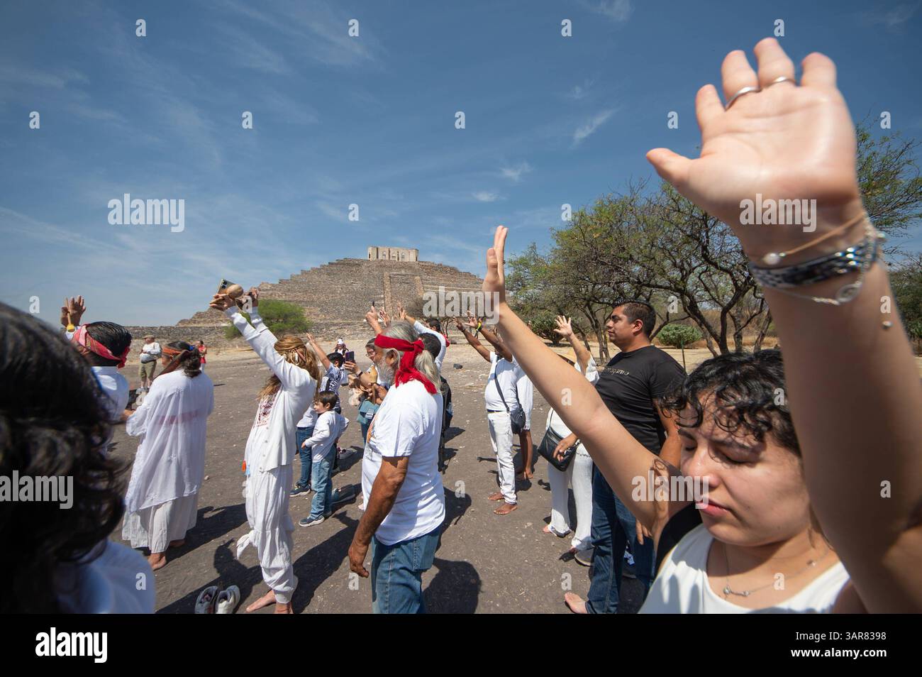 People Welcoming Spring Equinox in Queretaro A woman rises her hands ...
