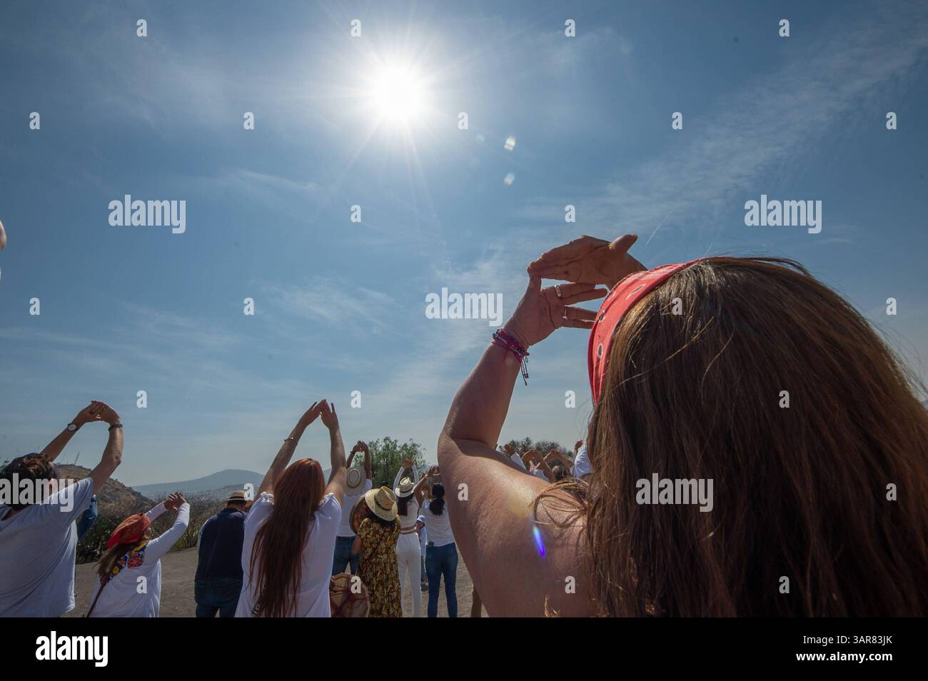 People Welcoming Spring Equinox in Queretaro A woman rises her hands ...