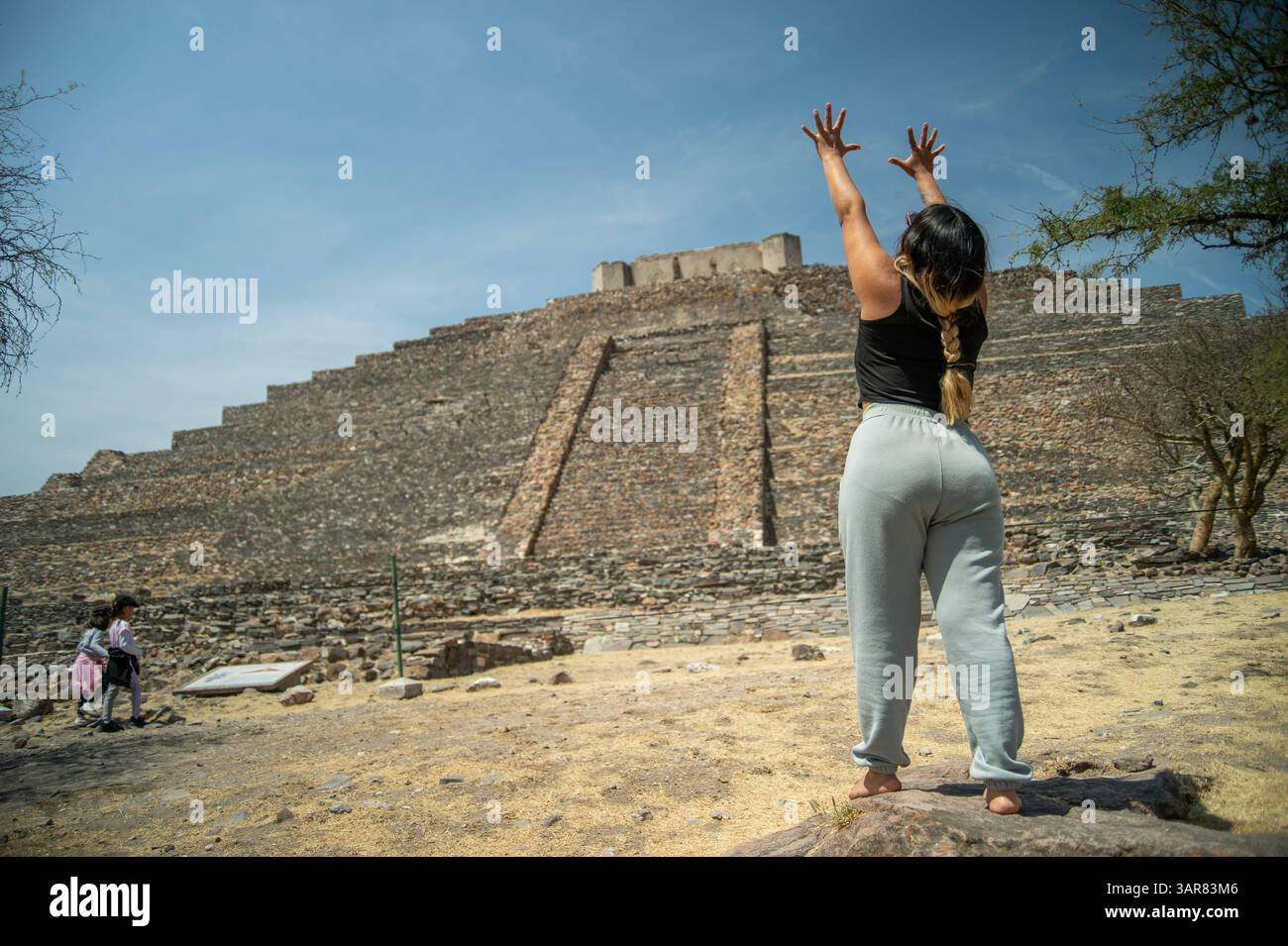 People Welcoming Spring Equinox in Queretaro A woman rises her hands ...
