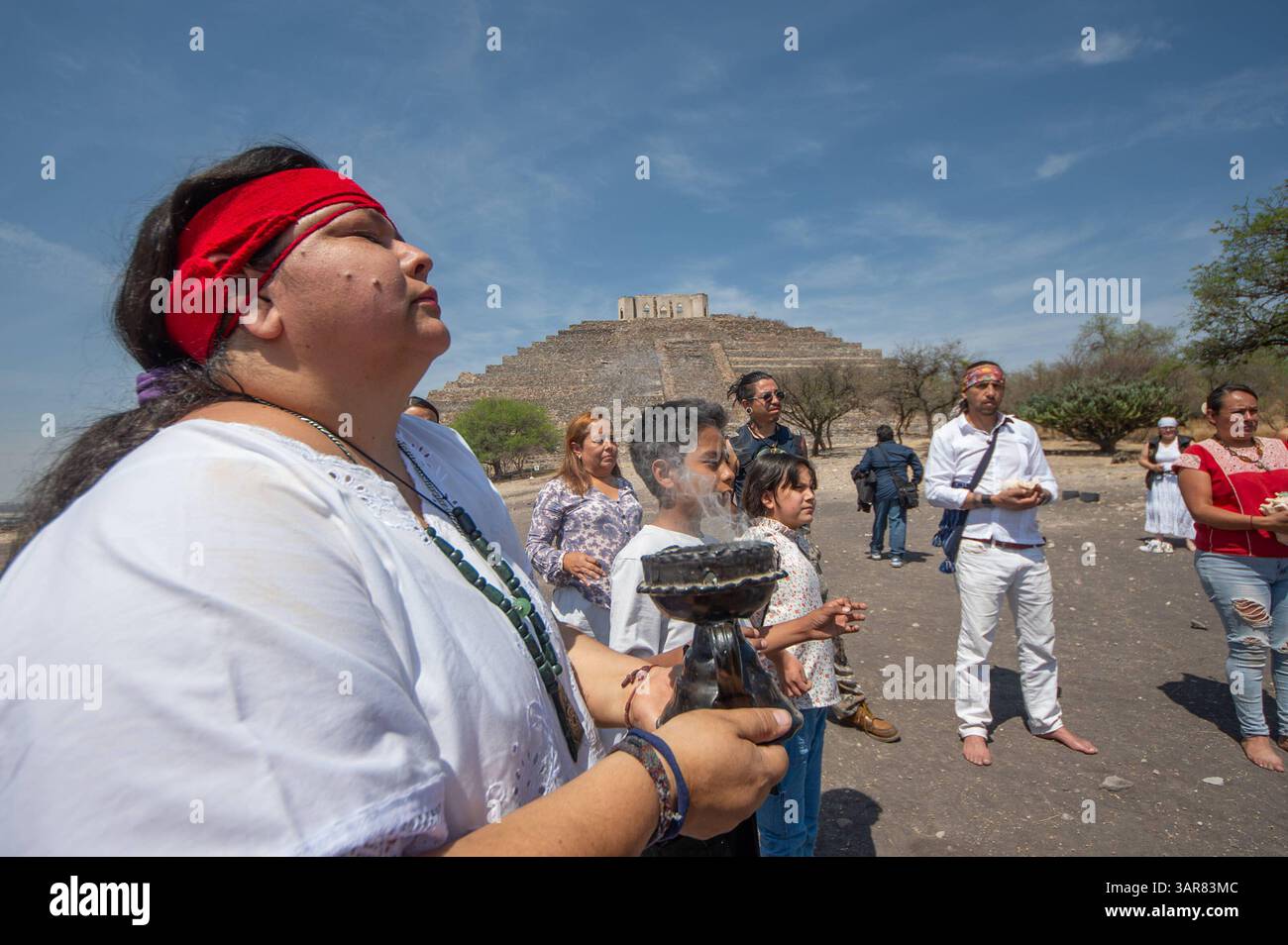 People Welcoming Spring Equinox in Queretaro A woman rises her hands ...