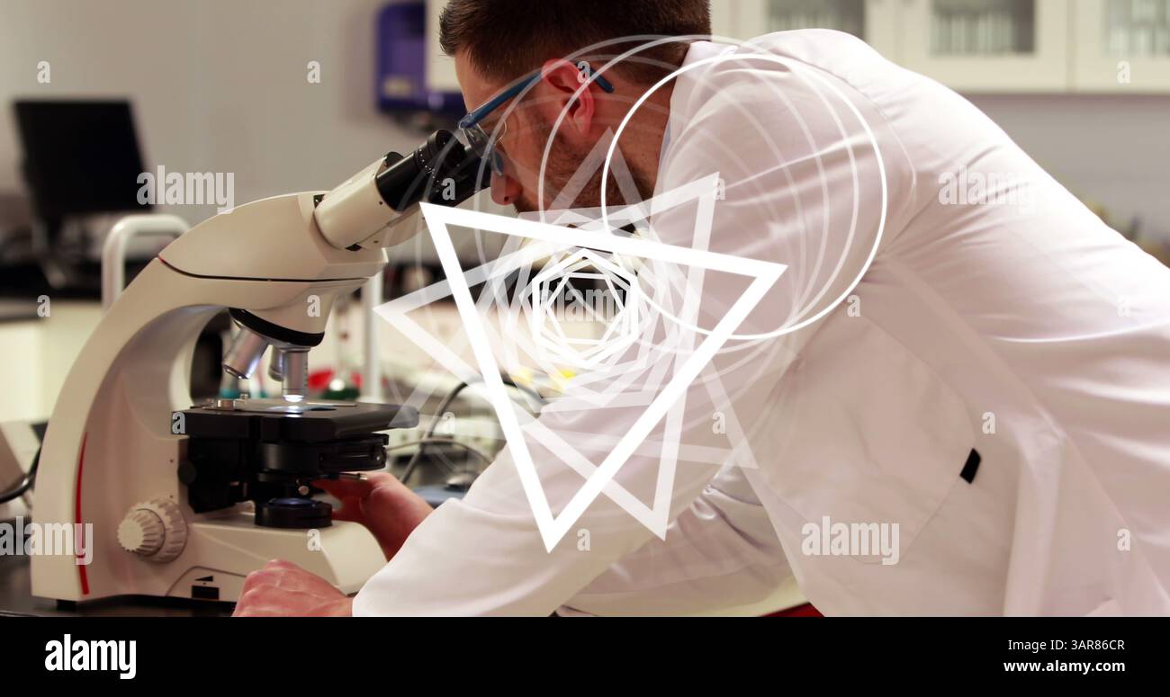 Image of shapes spinning over male scientist using microscope Stock ...