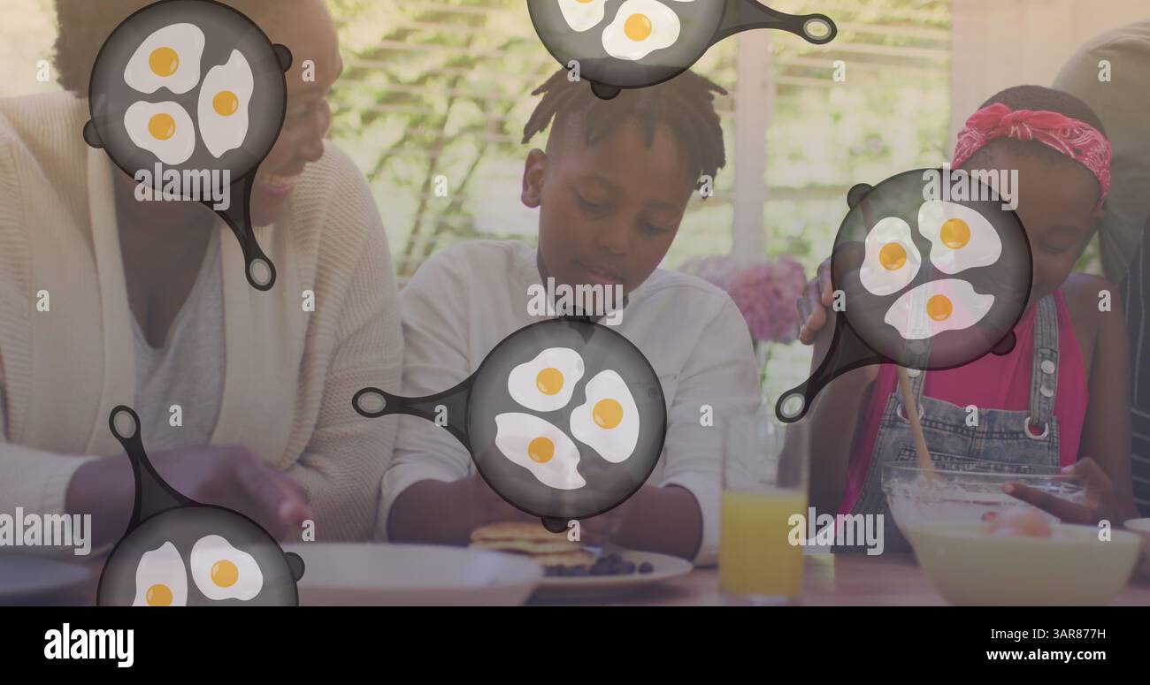 Image of pans falling over african american family cooking together in ...