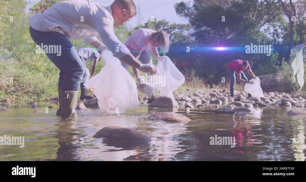 Image of lights over diverse happy group picking up rubbish in ...