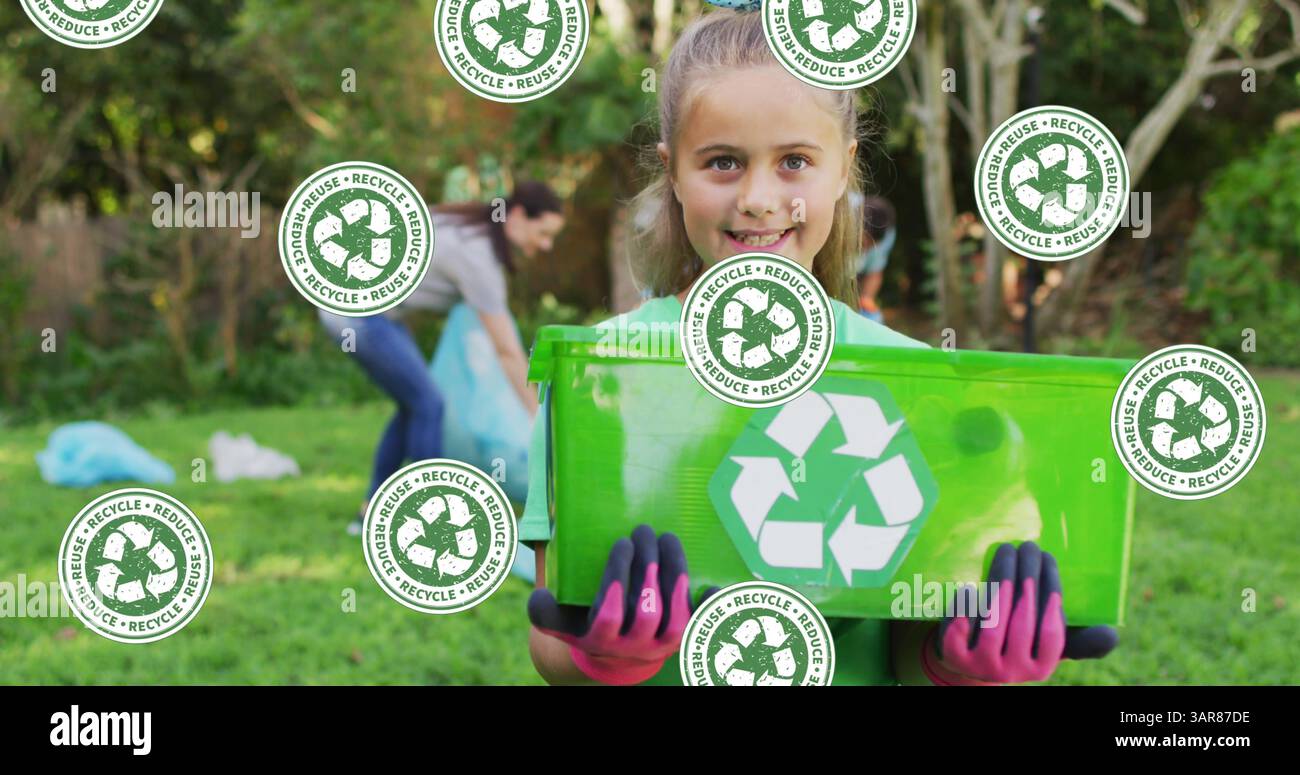 Image of falling recycling icons over happy caucasian girl holding ...