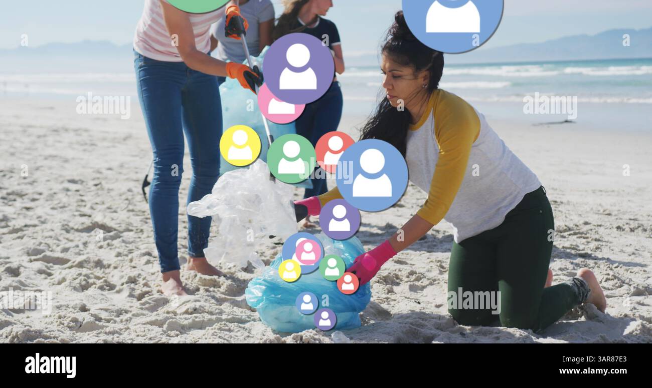 Image of falling people icons over diverse female group picking up ...