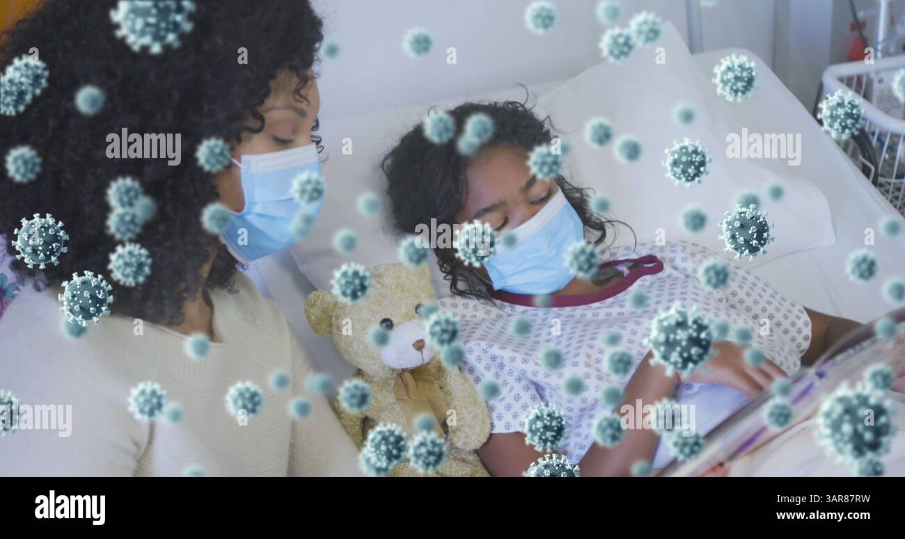 Image of virus cells over african american mother and daughter wearing ...