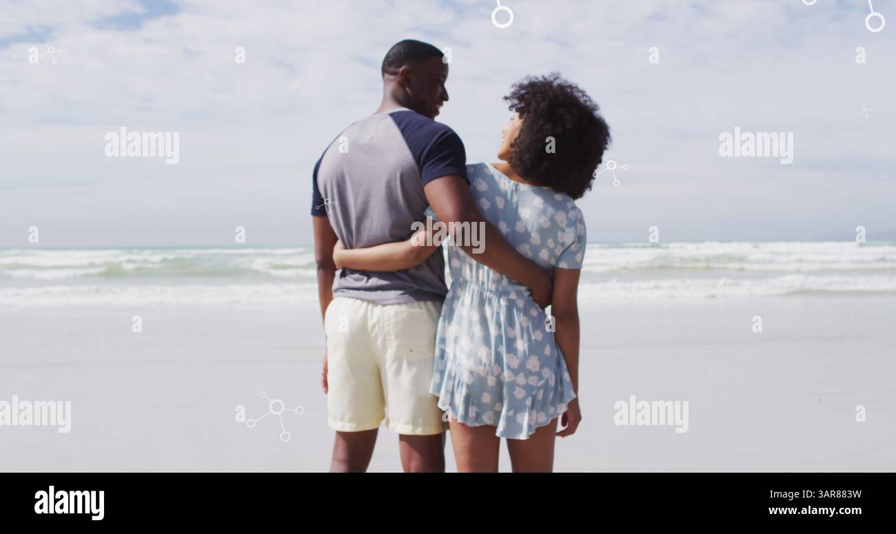 Image of molecules over back view of african american couple embracing ...