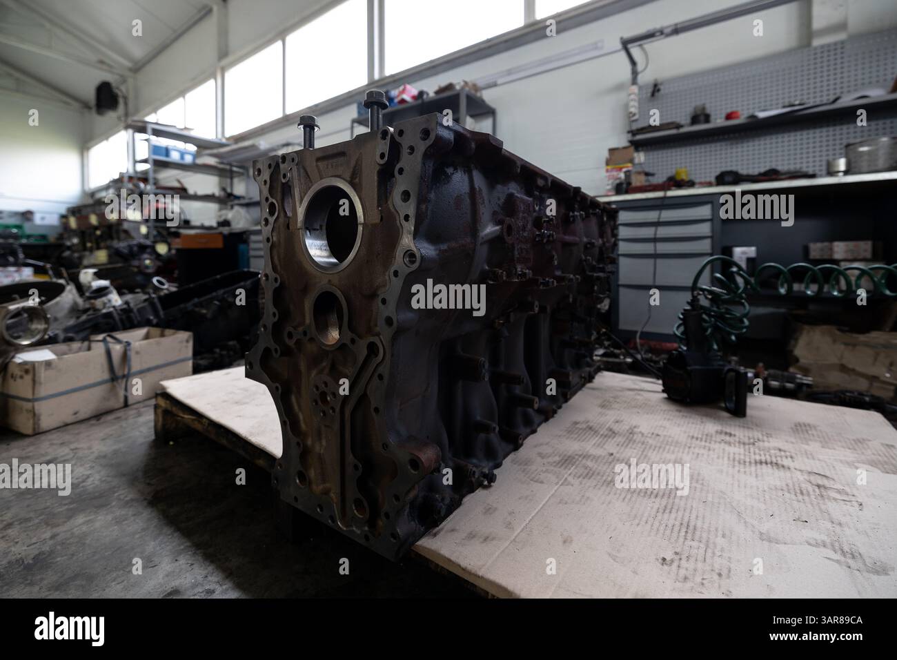 A Disassembled Diesel Truck Engine Block Stands In A Repair Shop Or