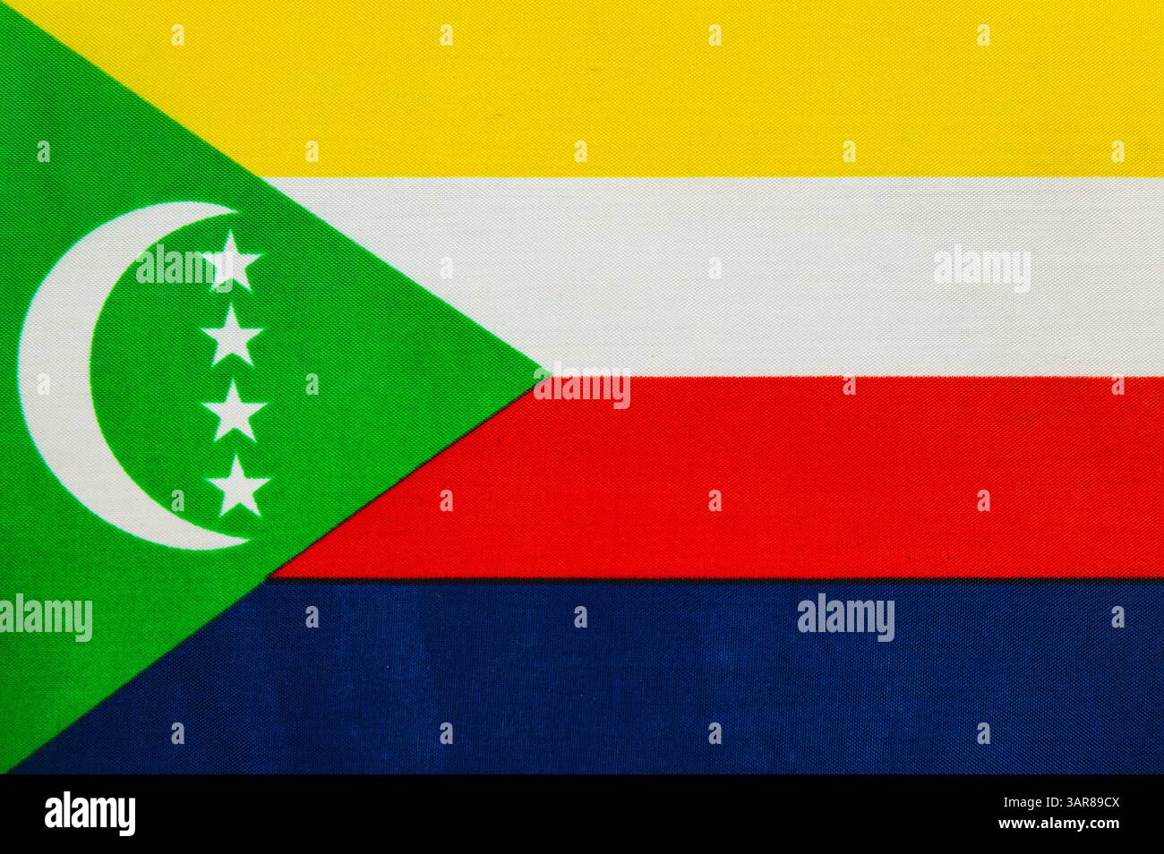 The flag displays a green triangle with a crescent and stars, alongside ...