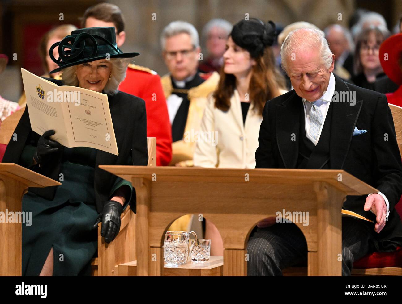 King Charles III and Queen Camilla laugh during the Royal Maundy ...