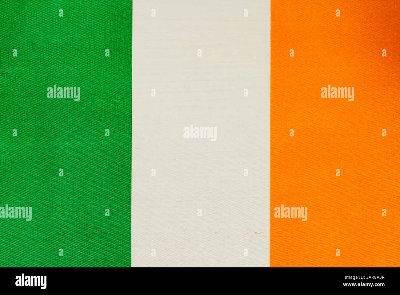 A vibrant Irish flag featuring three horizontal stripes of green, white ...