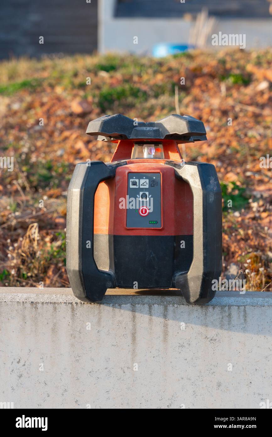 A laser level actively measuring on a land plot, ensuring precise ...
