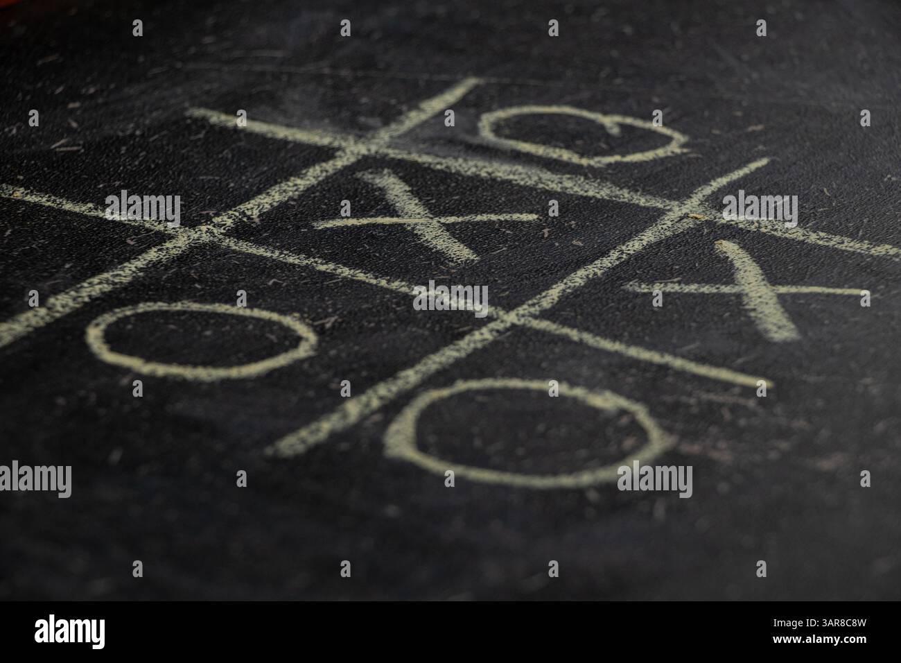 Children's game tic-tac-toe drawn on a school blackboard, play tic-tac ...