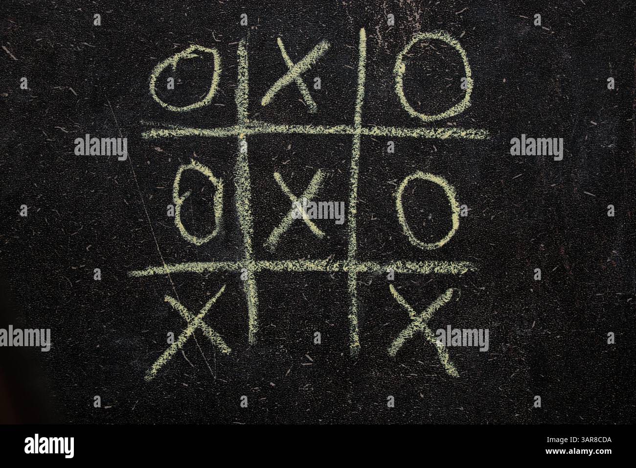 Children's game tic-tac-toe drawn on a school blackboard, play tic-tac ...
