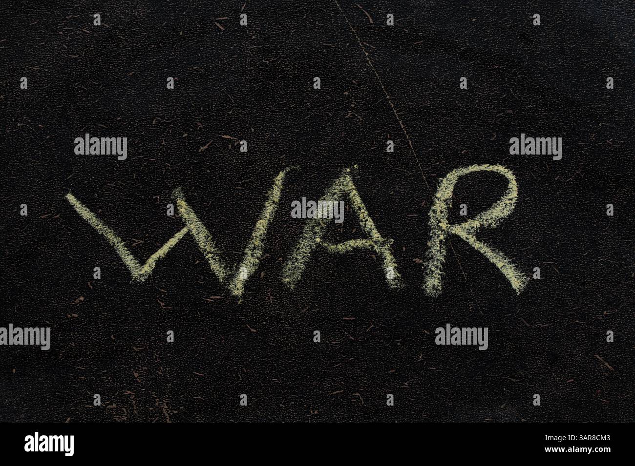 The word war is written on a black school board close-up Stock Photo ...