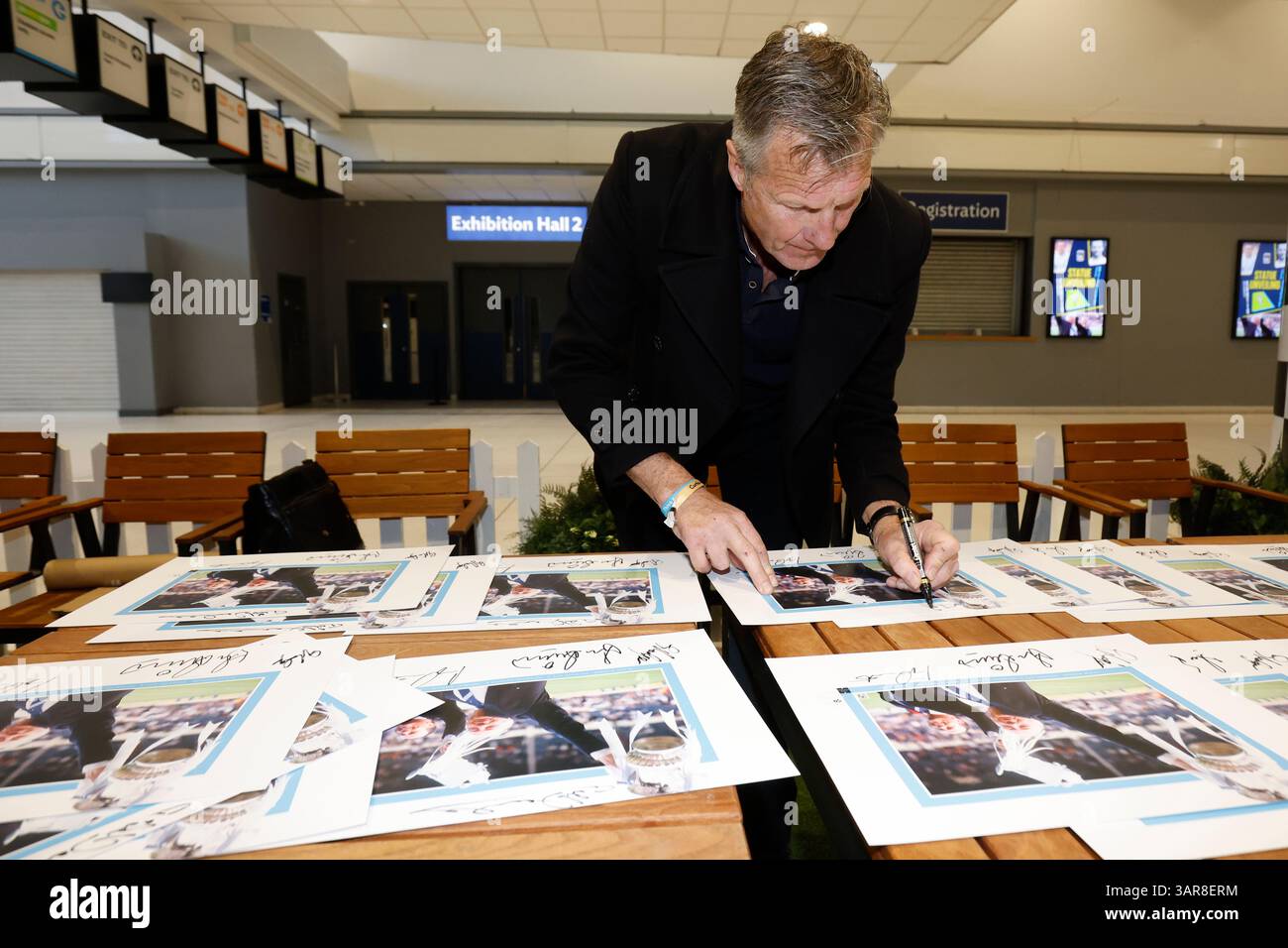 Former Coventry City player Keith Houchen signs prints during the ...