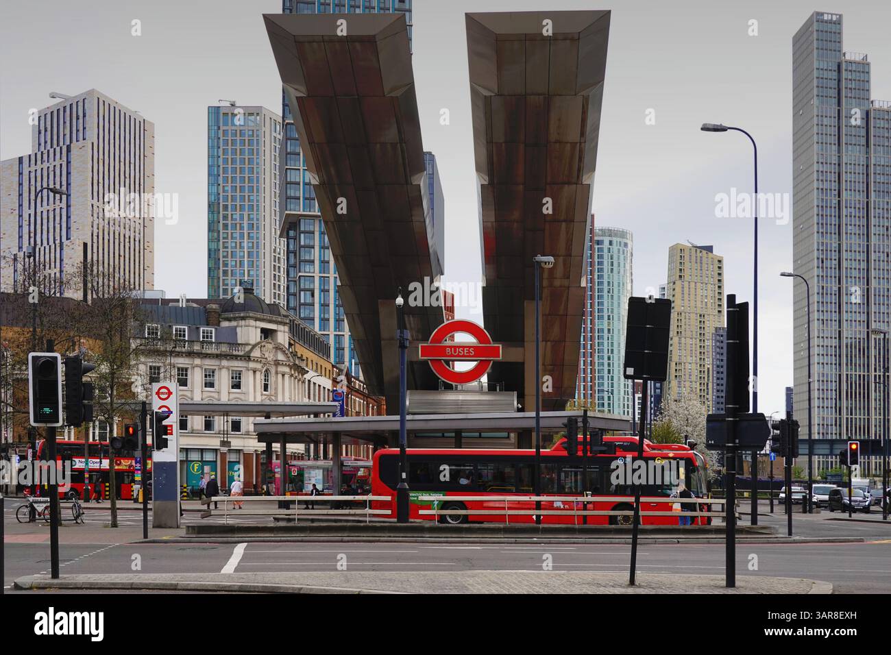 Single-decker bus passing busy Vauxhall bus station in the London ...