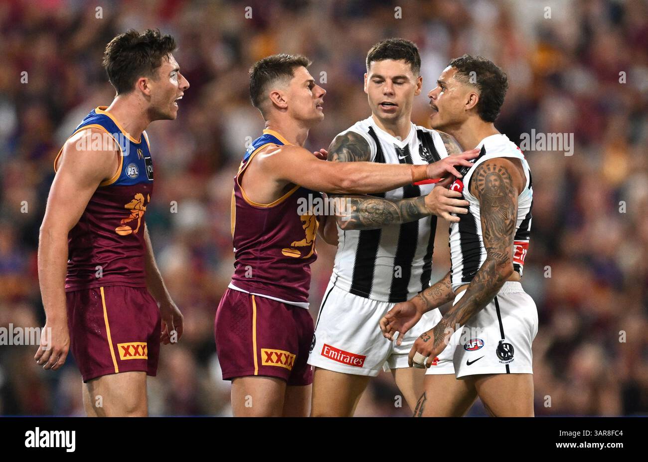 Bobby Hill of the Magpies reacts with Noah Answerth of the Lions during ...