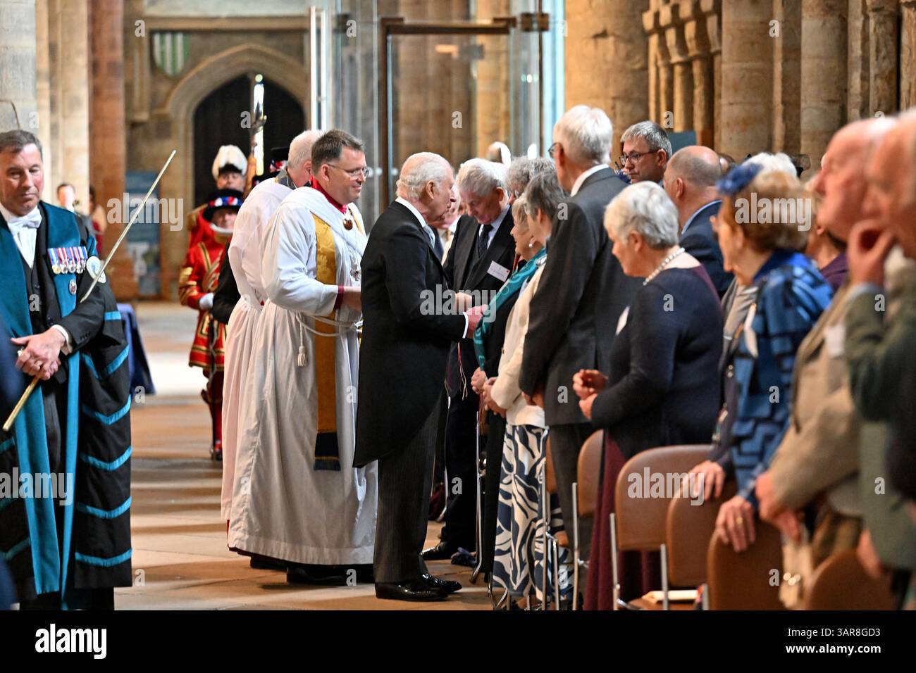 King Charles III speaks with a member of the congregation during the ...