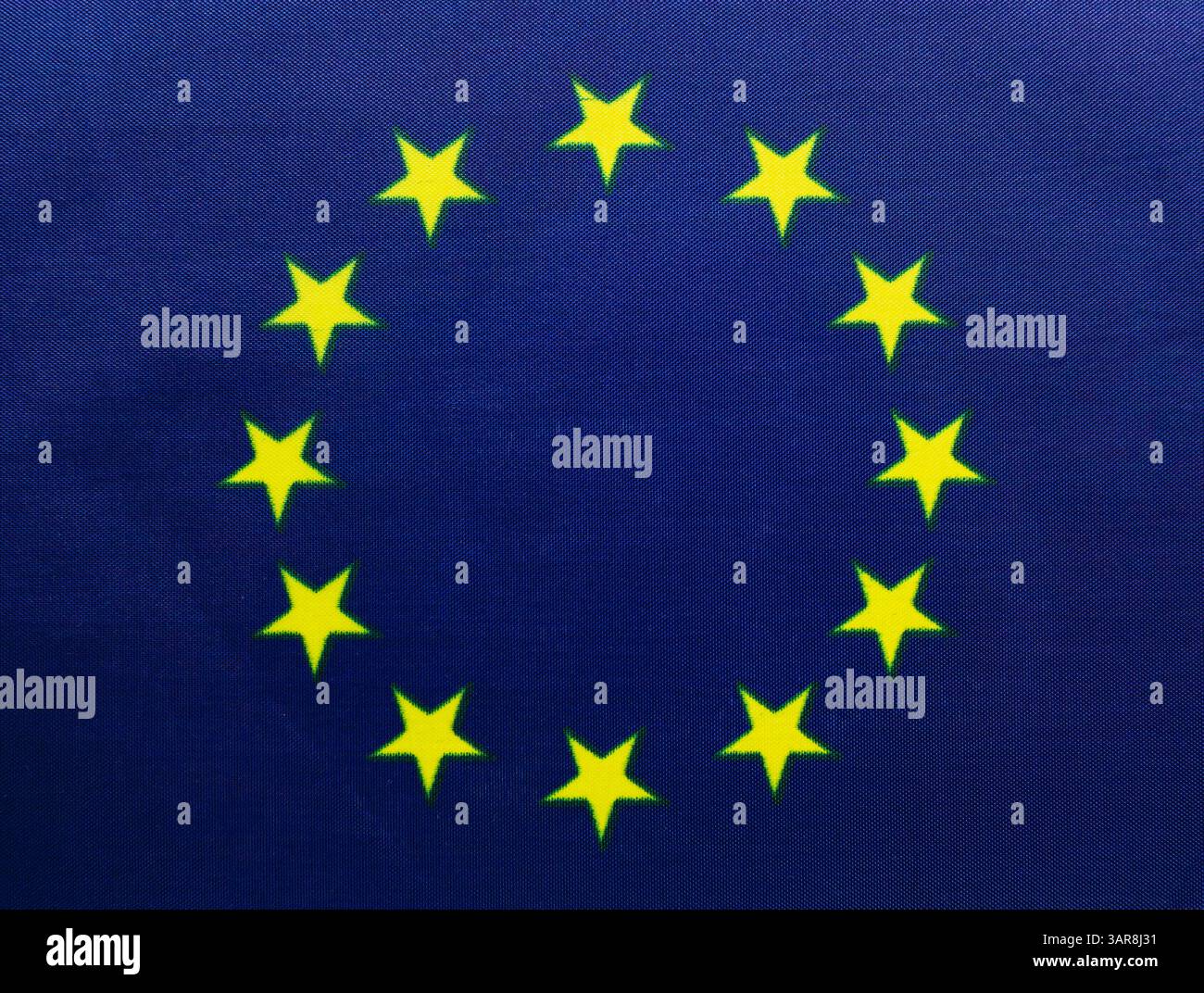 The emblem of the European Union displays a circle of yellow stars on a ...