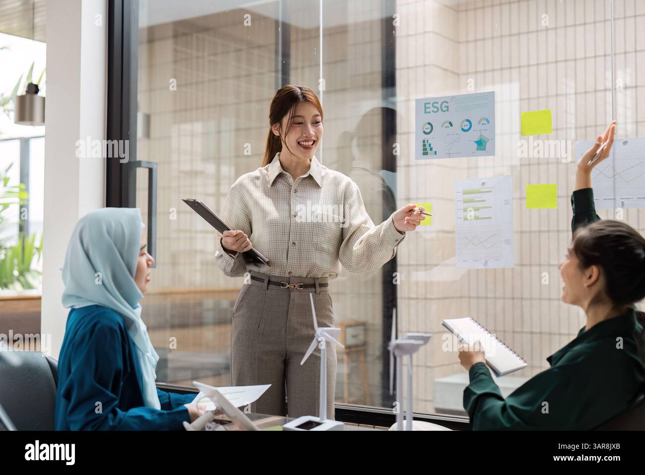 Sustainability and ESG Strategies. A diverse team discussing ESG ...