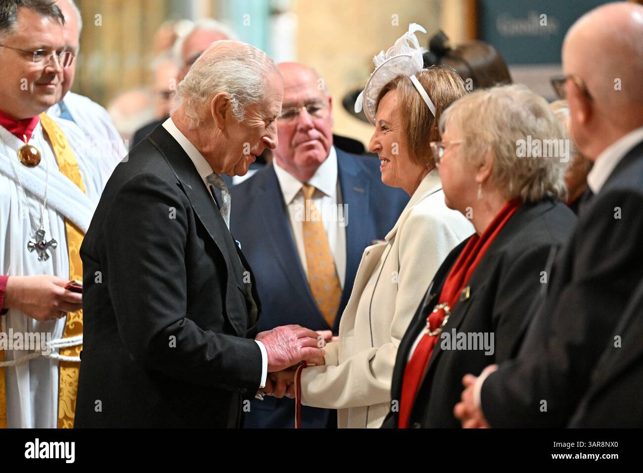King Charles III meets members of the congregation during the Royal Maundy Service at Durham ...