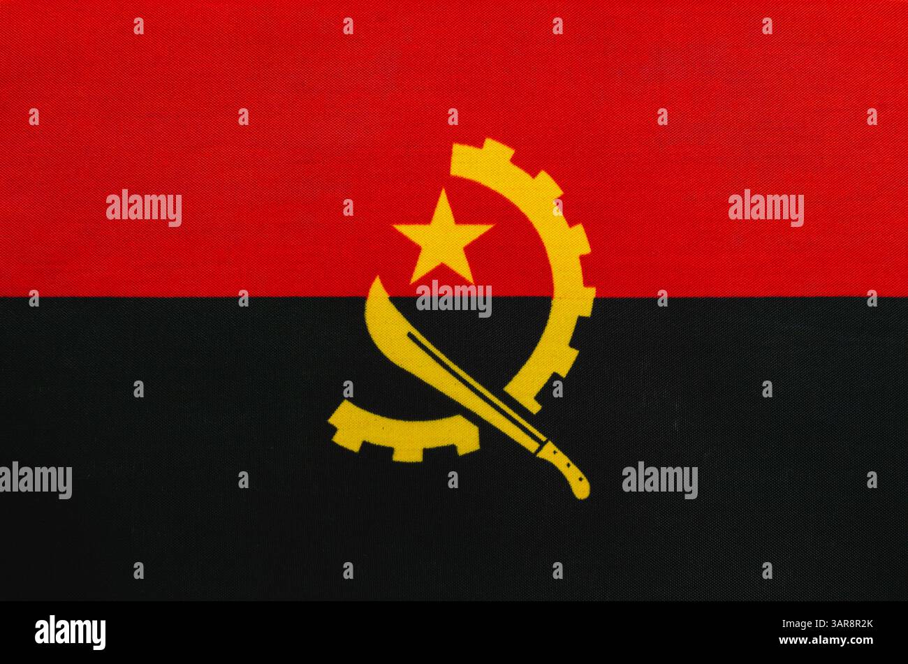 A vibrant flag of Angola featuring red, black, and yellow colors is ...
