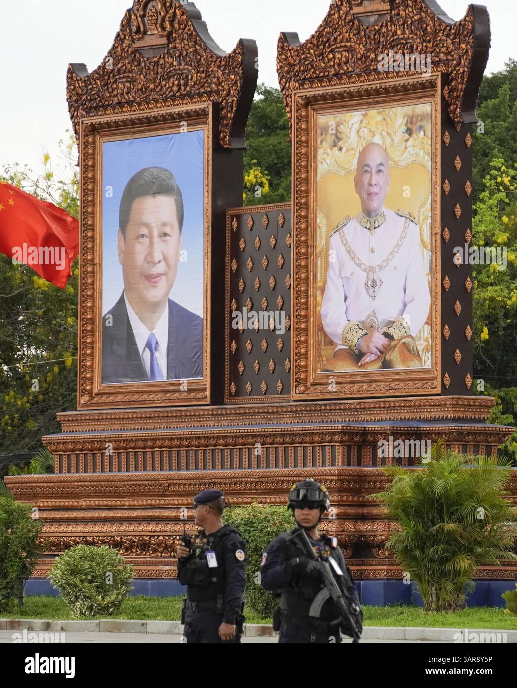 Security officers stand guard in Phnom Penh on April 17, 2025, with Chinese President Xi Jinping ...