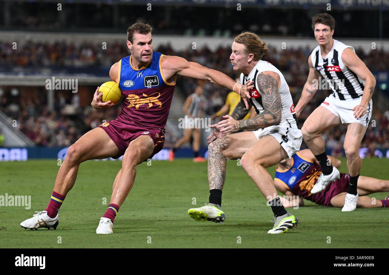 Jack Payne of the Lions and Beau McCreery of the Magpies during the AFL ...